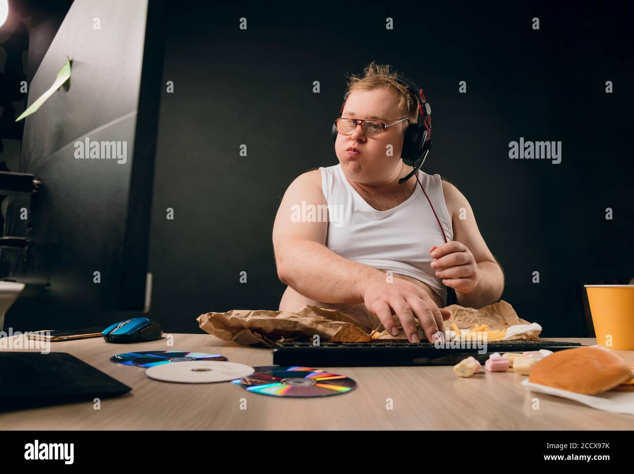 man with plump cheeks eating breakfast with gluttony. close up side ...