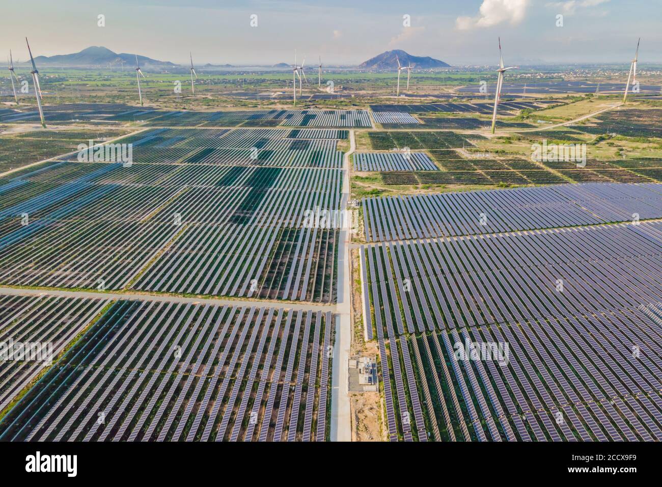 solar energy panels and wind turbine. Drone view Stock Photo - Alamy