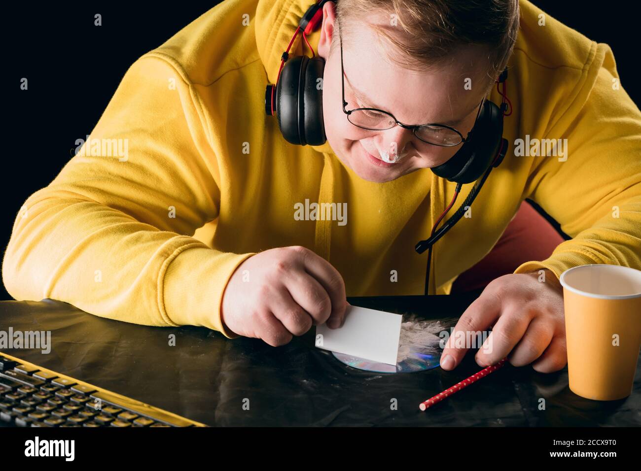 cheerful happy man going to take drugs. close up photo. isolated black ...