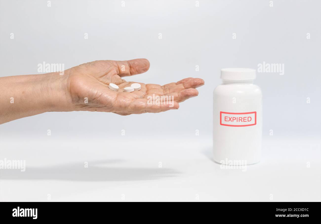 Expired drug on elderly hand Stock Photo - Alamy