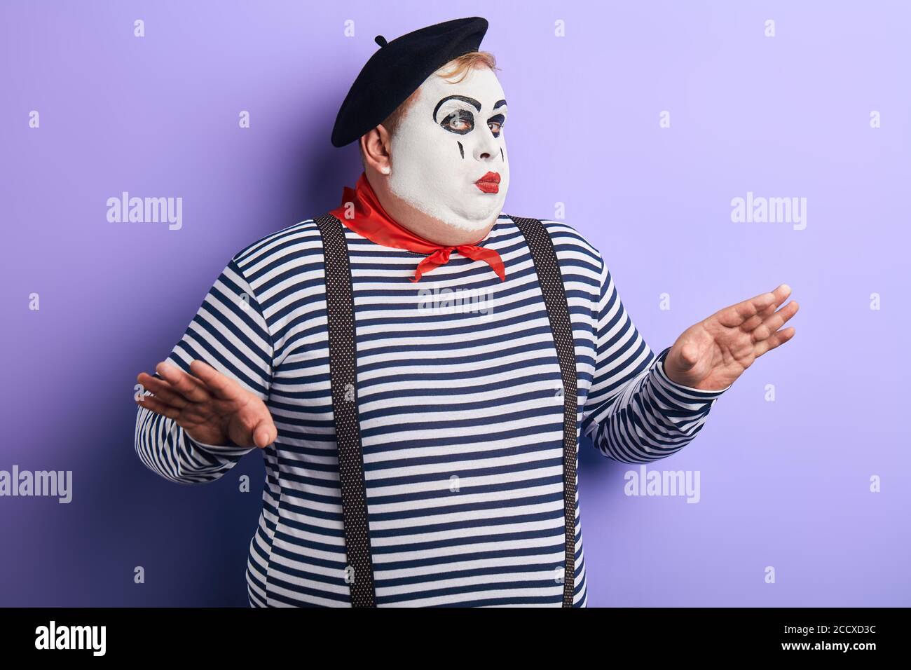talented actor with raised arms showing pantomime. close up portrait ...