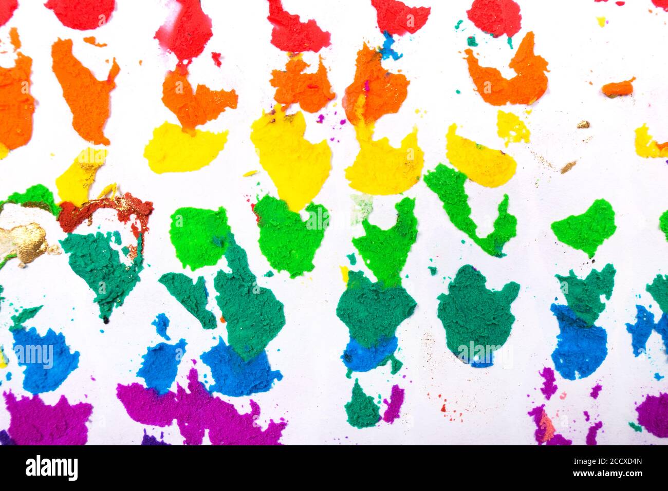 Rainbow rough plaster texture on white background. Close up wall grunge ...