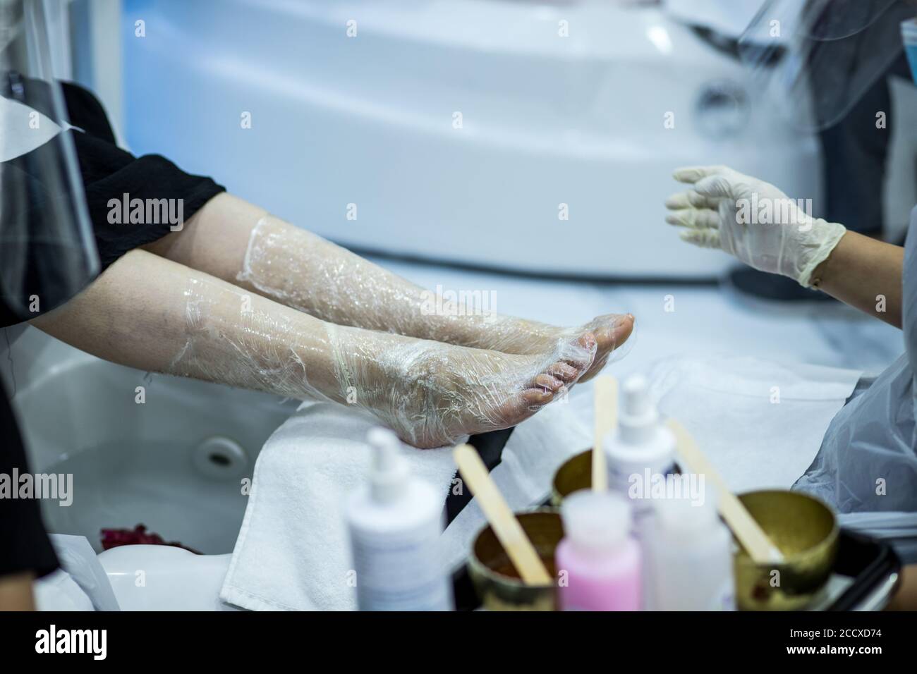 female getting foot treatment in saloon ,spa Stock Photo - Alamy