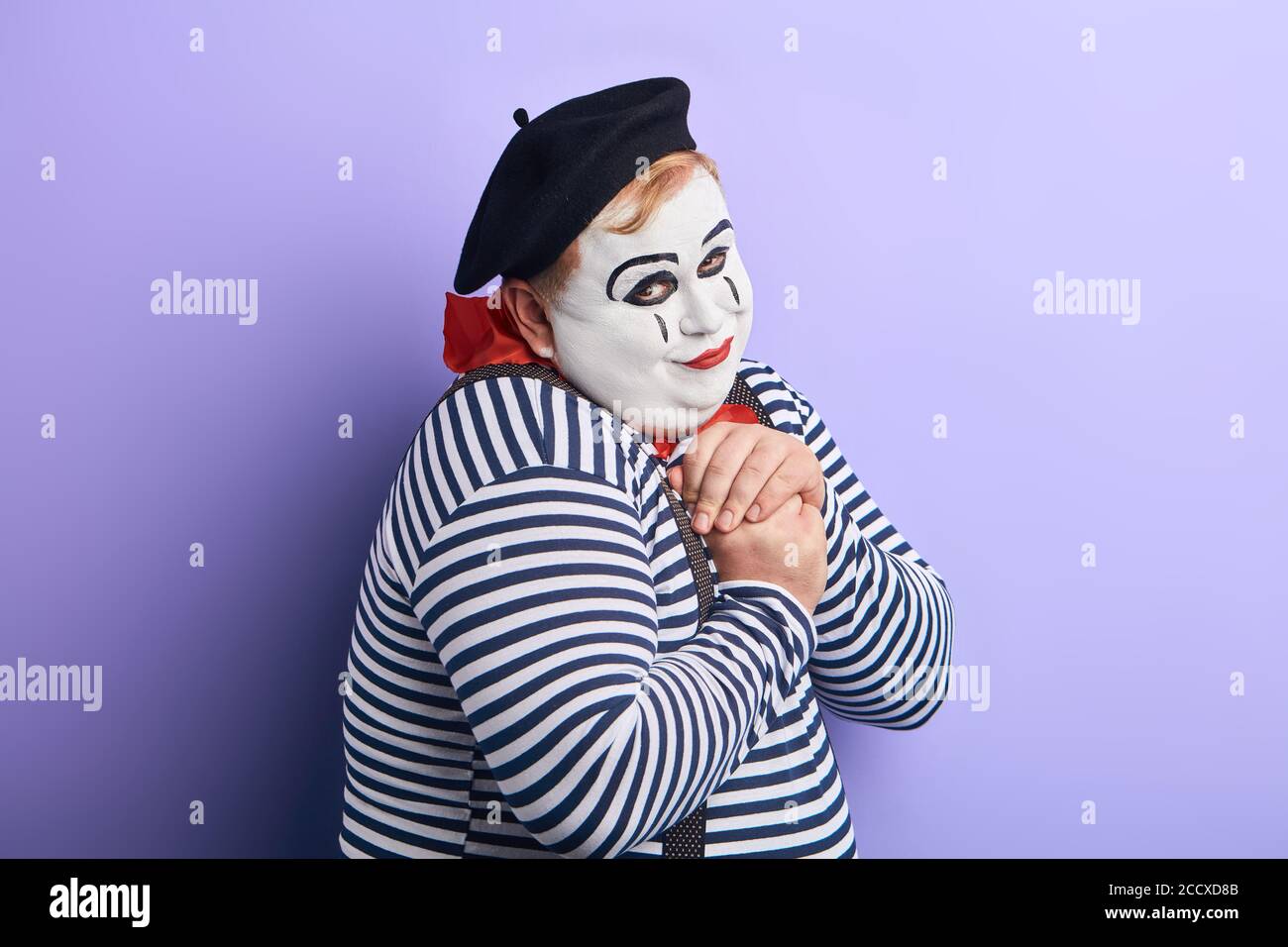 shy fat clown hesitates to show performance or not, close up portrait ...
