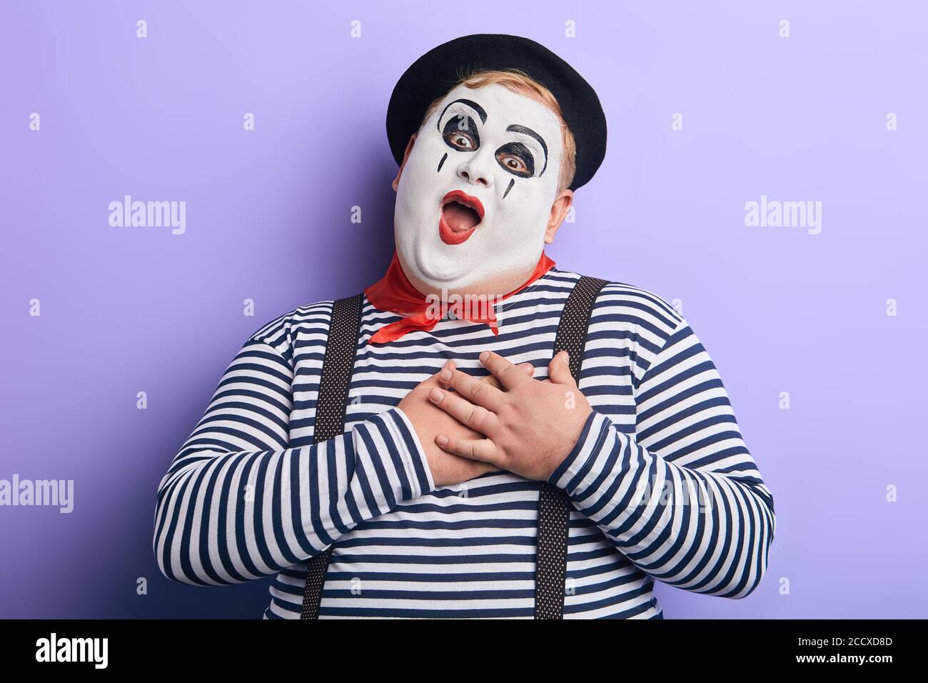 funny man keeps hands on heart expressing love to girlfriend. I love ...