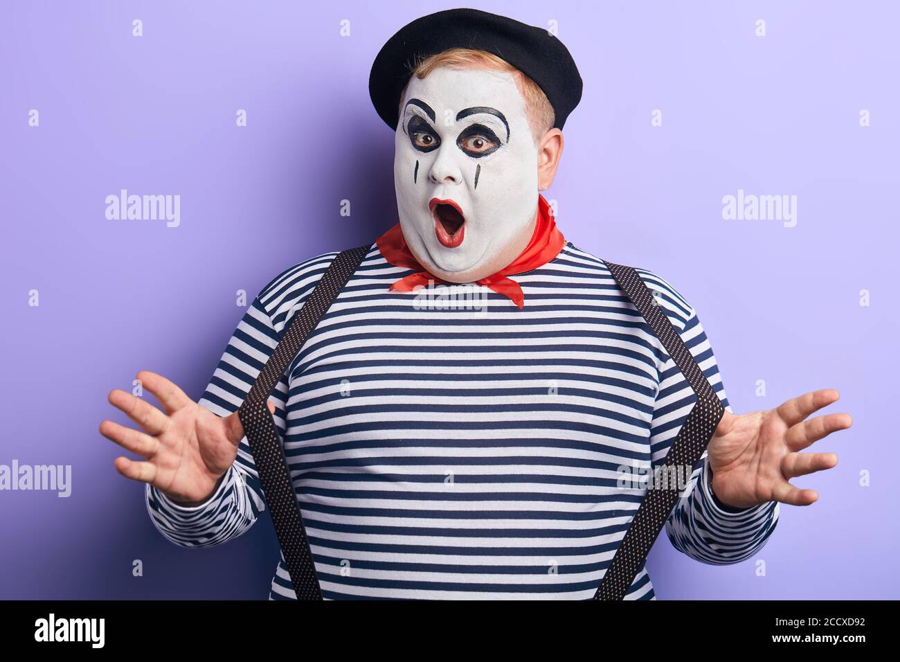 crazy talented mime performing pantomime isolted on blue background ...