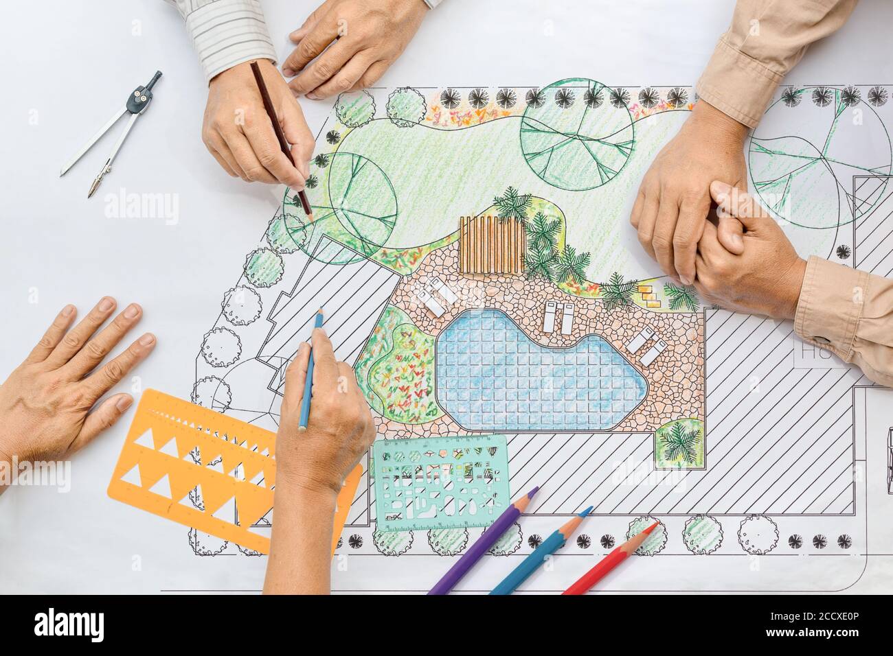 Landscape architect changing drawing at meeting with client Stock Photo ...