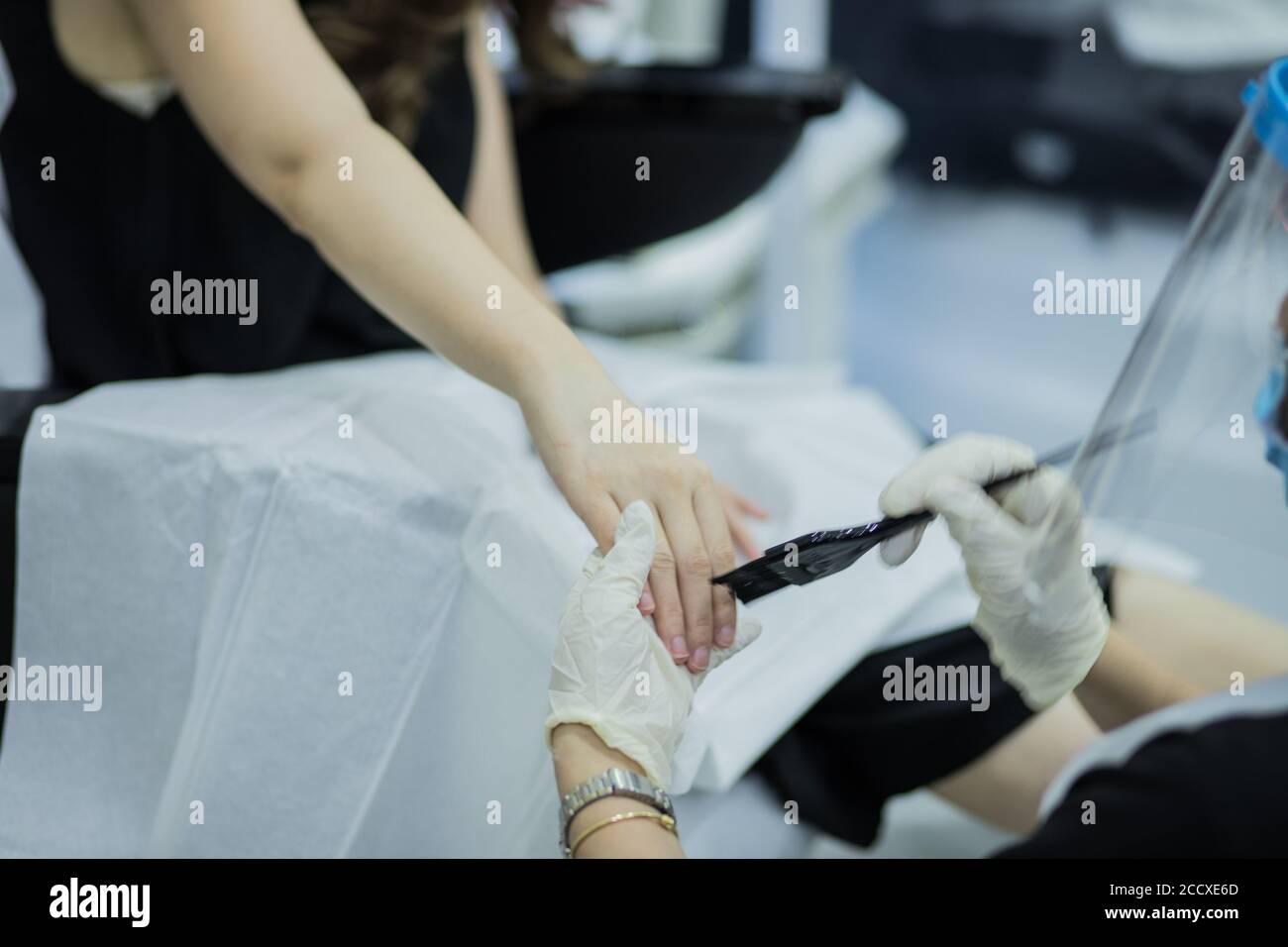 female getting hand treatment in saloon, spa Stock Photo - Alamy