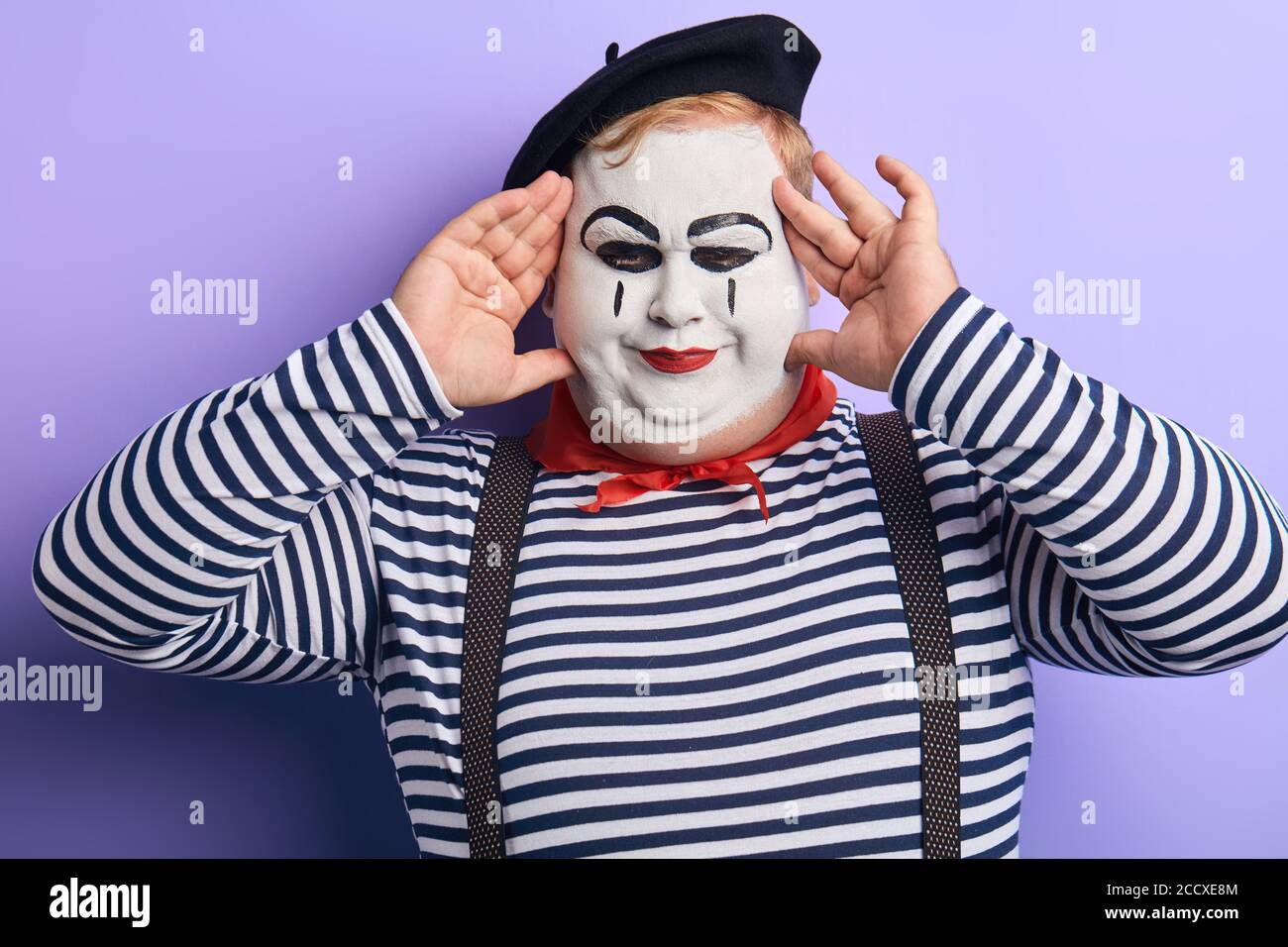 funny man entertaining children during the party, mime having fun ...
