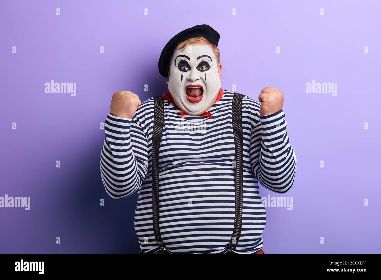 carzy fat mime with raised arms rejoicing at success, victory, isolated ...