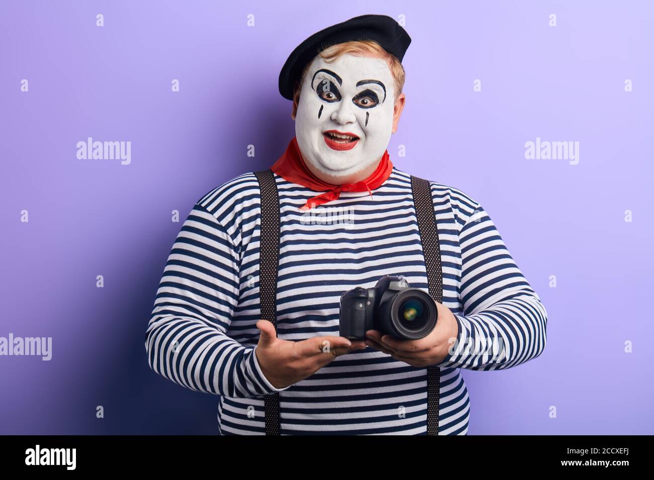 excited emotional fat actor pretending being photographer. close up ...