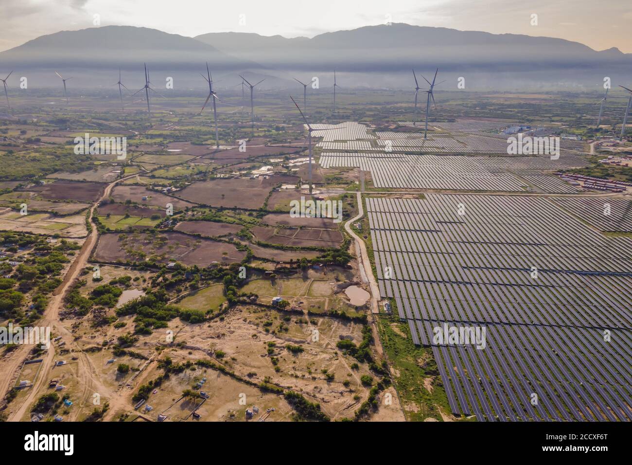 solar energy panels and wind turbine. Drone view Stock Photo - Alamy