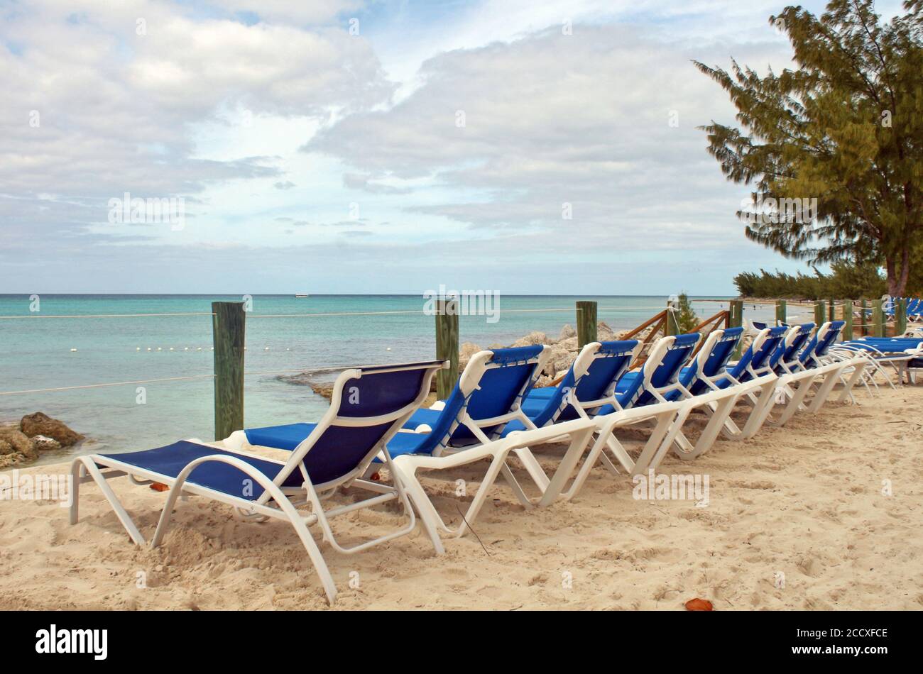 Lounge chairs on the beach Stock Photo - Alamy