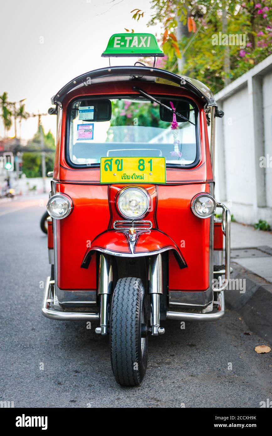 Red tuk tuk parked on street in Chiang Mai Stock Photo - Alamy
