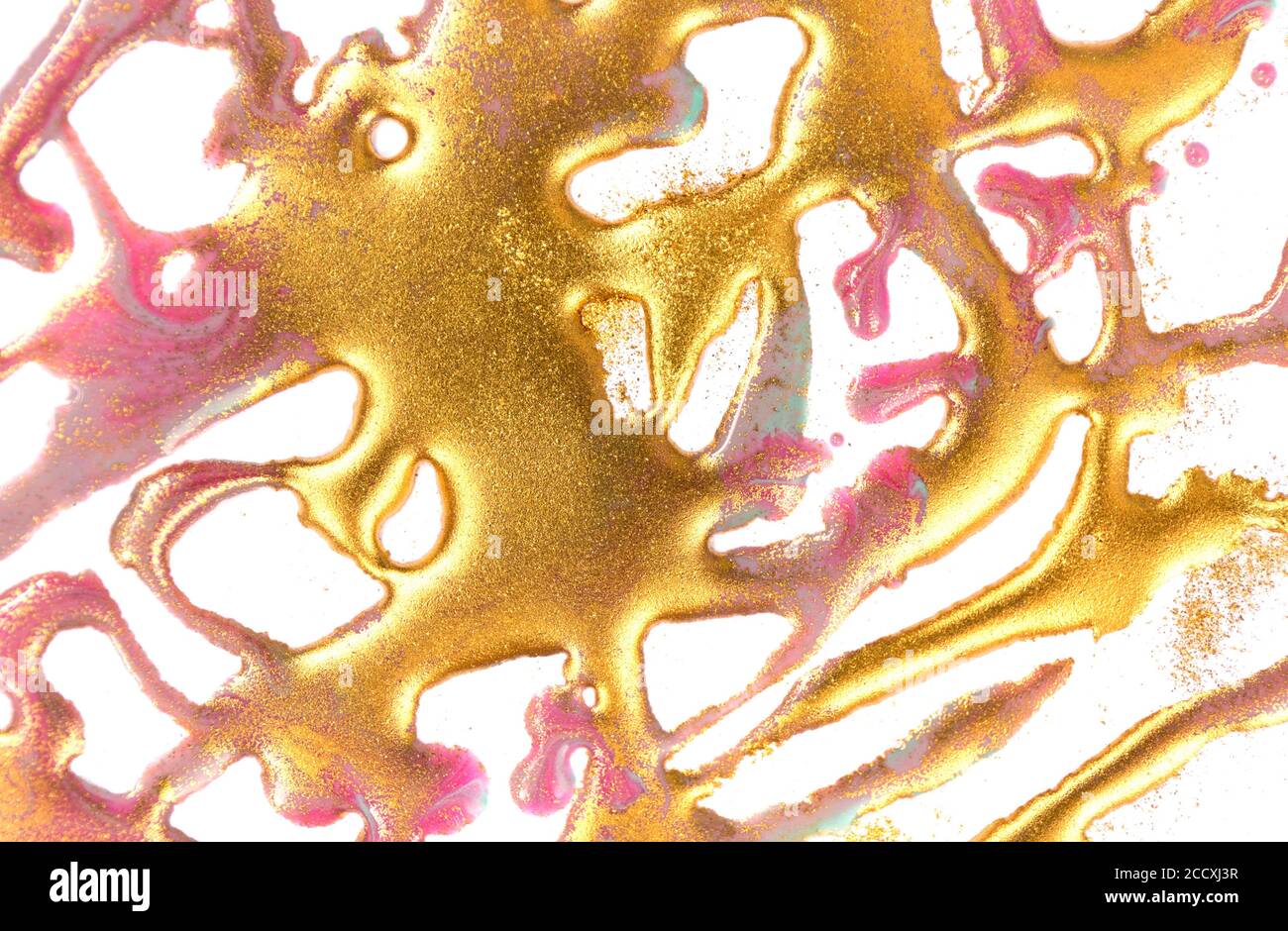 Golden ink drops and stains on white paper background Stock Photo - Alamy