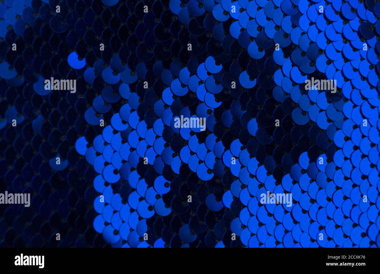 Blue shine scales Sequins close-up background Stock Photo - Alamy