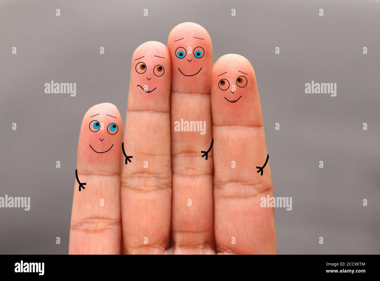 Happy family finger face Stock Photo - Alamy