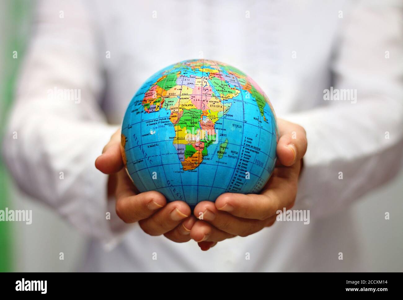 women holding world map globe on her hand Stock Photo - Alamy