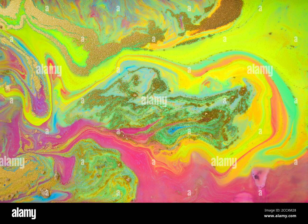 Fluorescent liquid ink with golden gold stains Stock Photo - Alamy