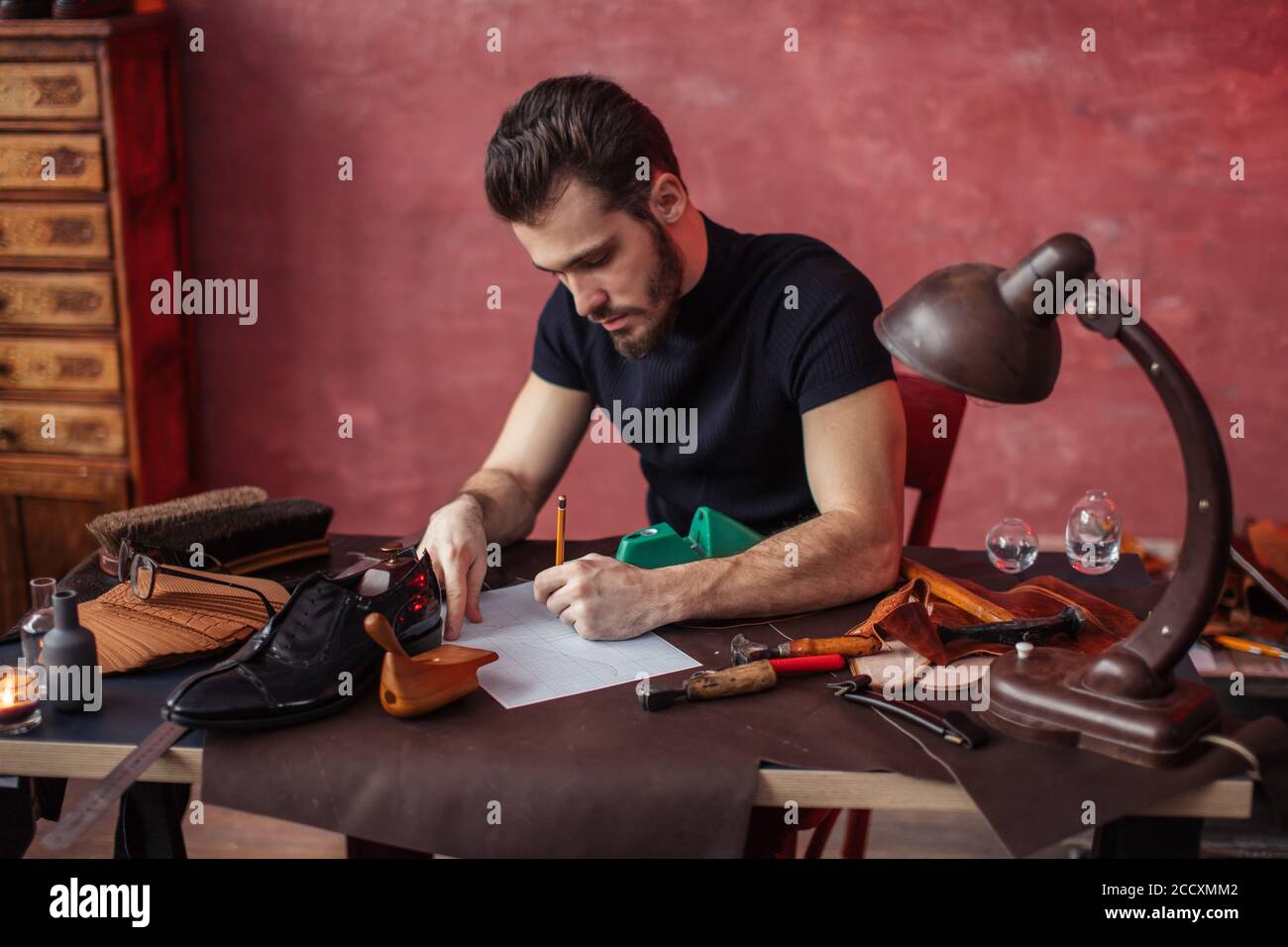 guy attending shoe making classes, education, a part time job Stock ...