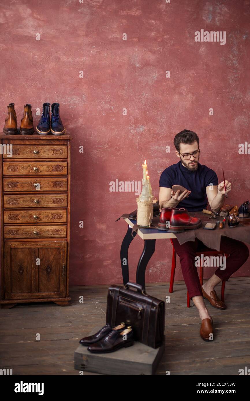 transformation of insoles. young talented man giving a specific color ...