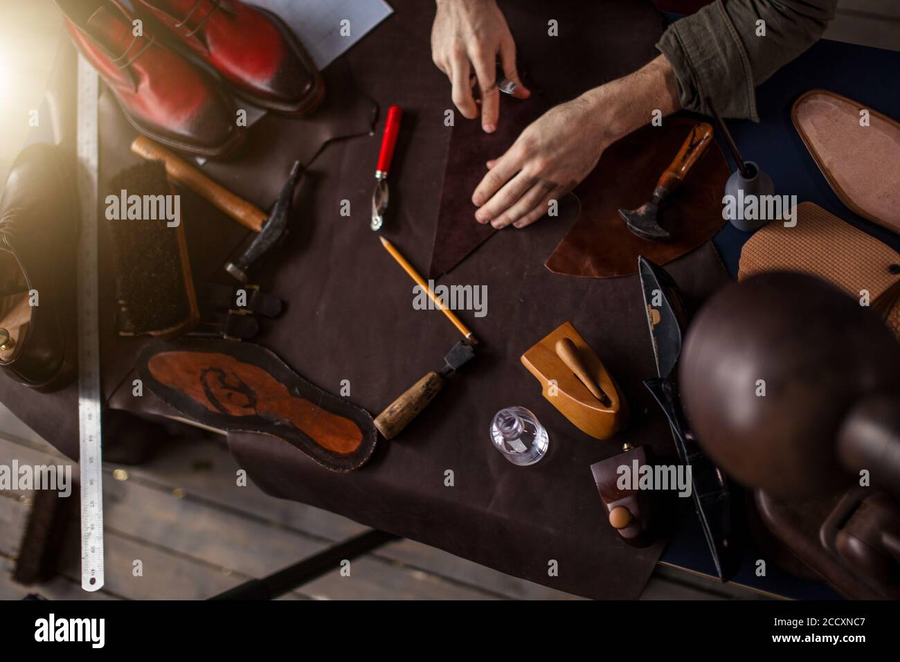 close up cropped top view photo. shoemakers' tools for fixing footwear ...