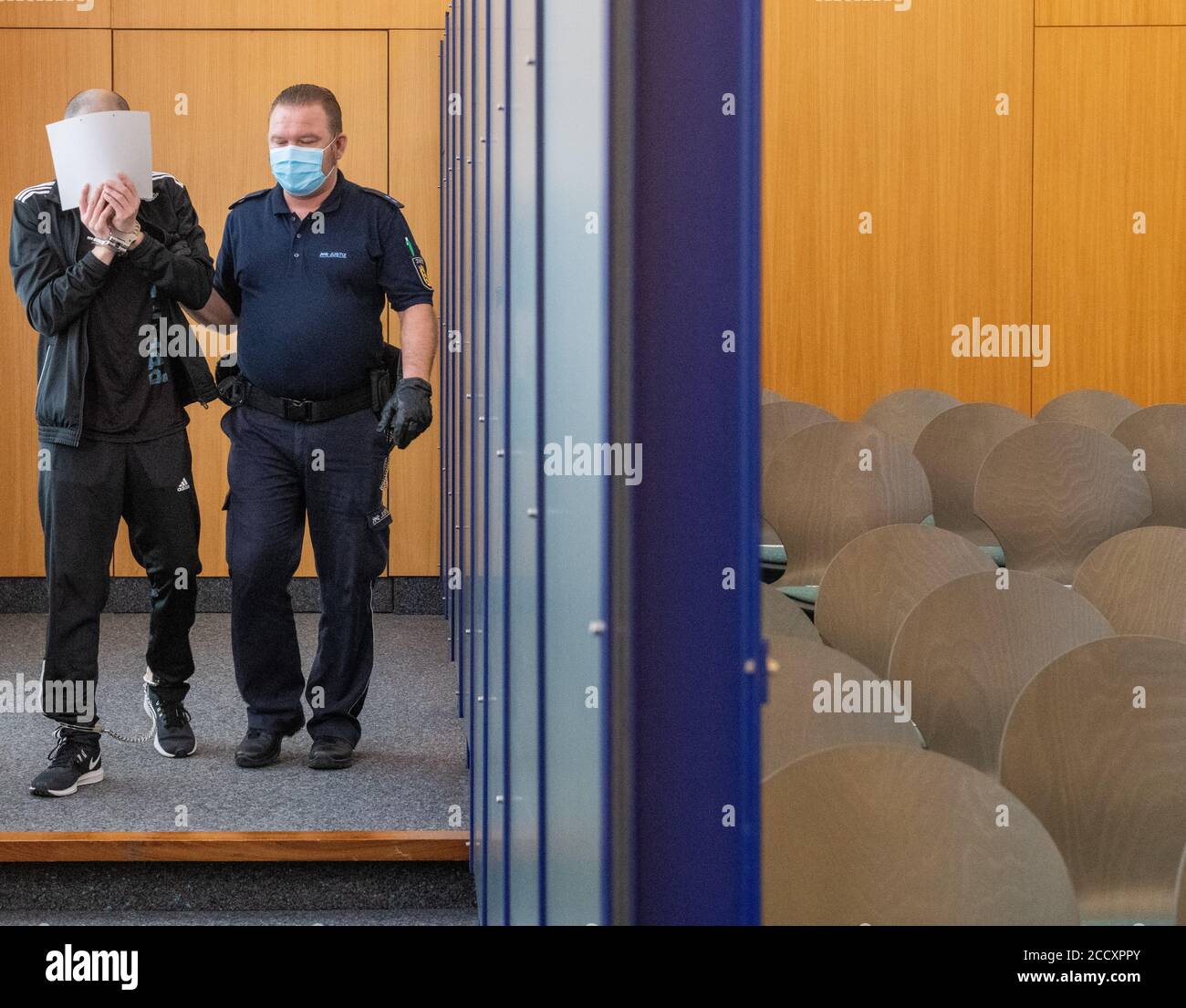 Ulm, Germany. 25th Aug, 2020. In the regional court, a judicial officer ...