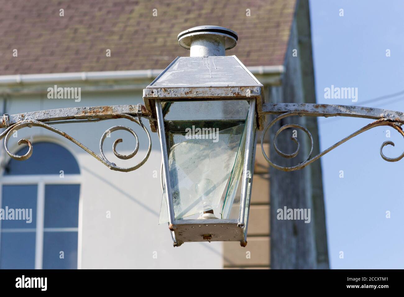 Broken victorian lantern above an iron gate Stock Photo - Alamy