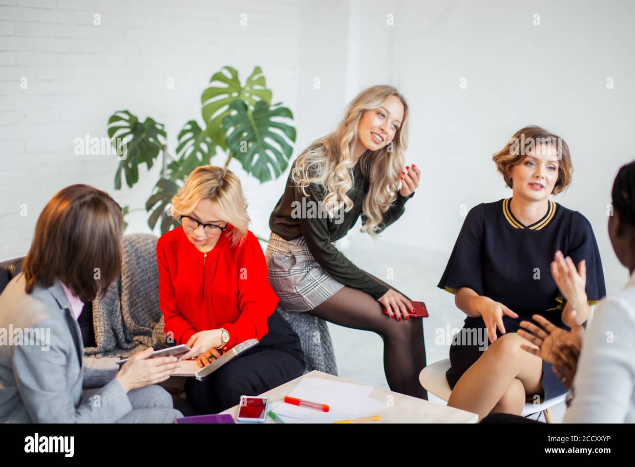 Brainstorming concept. Group of successful mixed race female ...