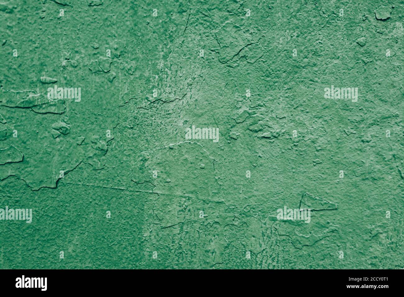 textured old vintage wall with a faded green paint color and plaster ...