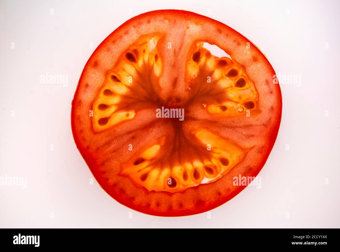 Slice of a tomato, fruit vegetables, white background, food photography ...