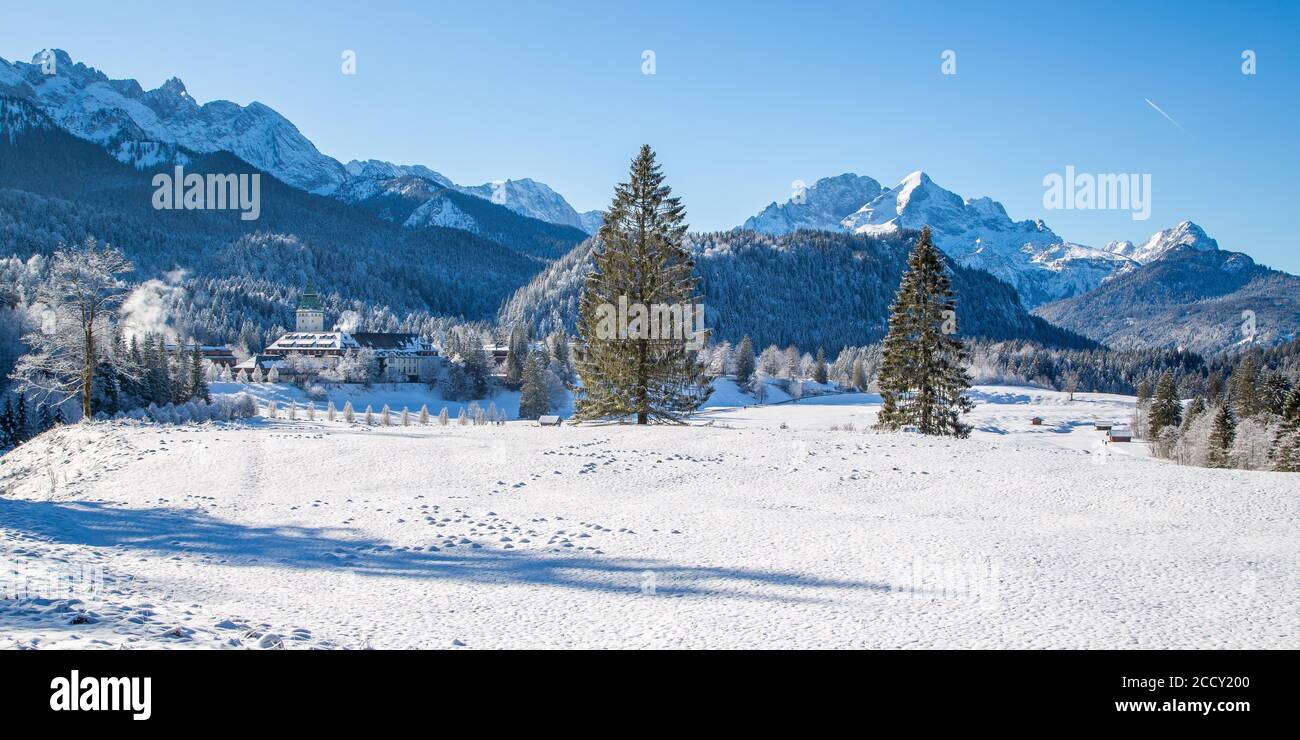 Luxury Hotel Elmau Castle in winter, behind Wetterstein range, Panorama ...