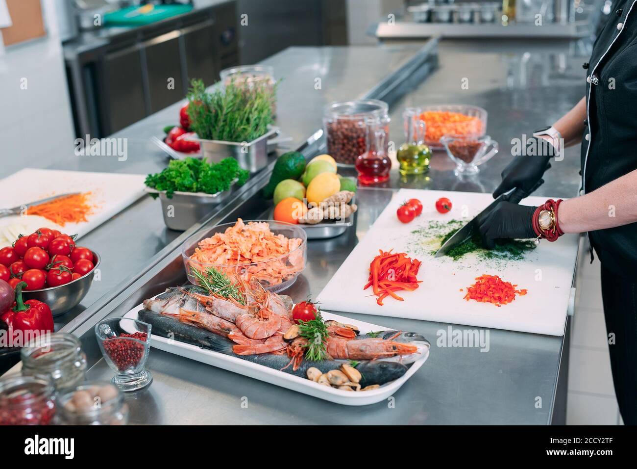 Professional cook cuts vegetables hi-res stock photography and images ...