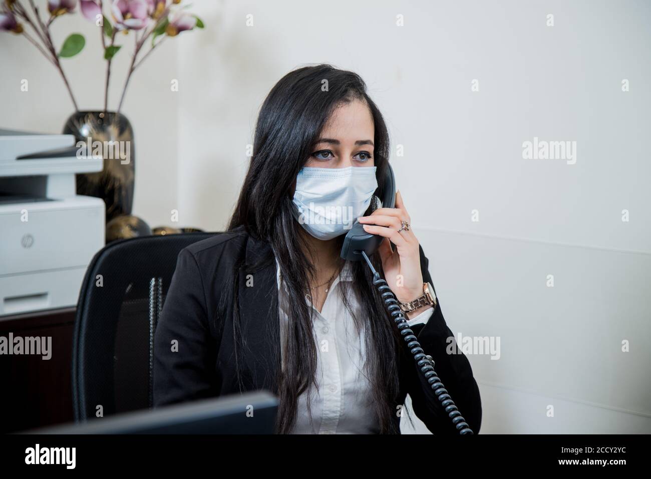 Receptionist - female in black and white dress Telephone Receptionist ...