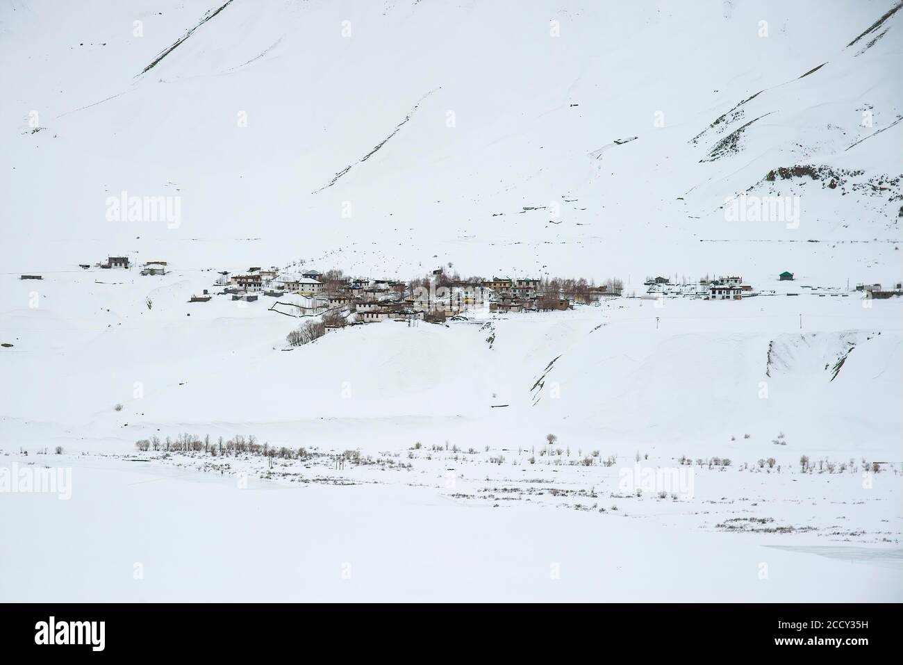 A snow covered village in the high altitude mountains in Spiti region ...