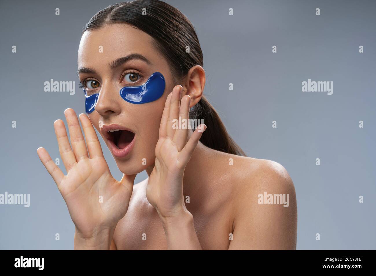 Attractive woman during cosmetic procedure hi-res stock photography and ...