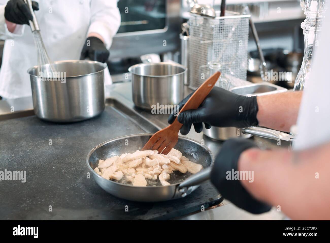 Woman cooks in kitchen hi-res stock photography and images - Alamy