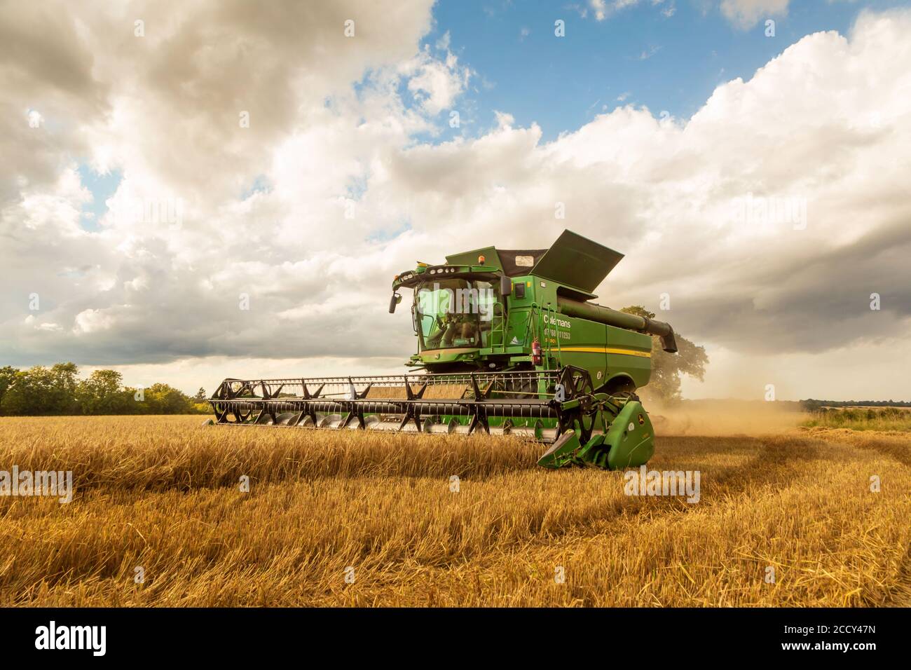 Combine harvester harvesting Barley in a field Stock Photo - Alamy