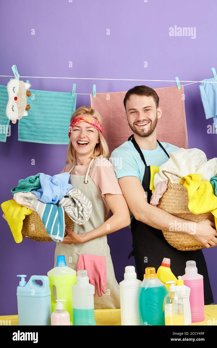 young couple rejoicing at washing process.happy family get pleasure ...