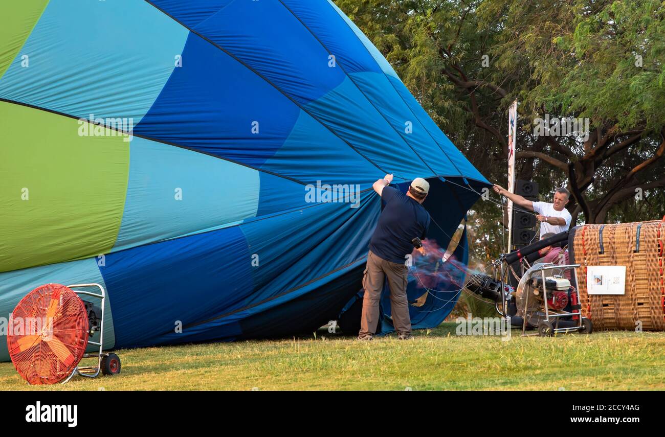 Ground crew preparing a hot air balloon before takeoff Stock Photo - Alamy
