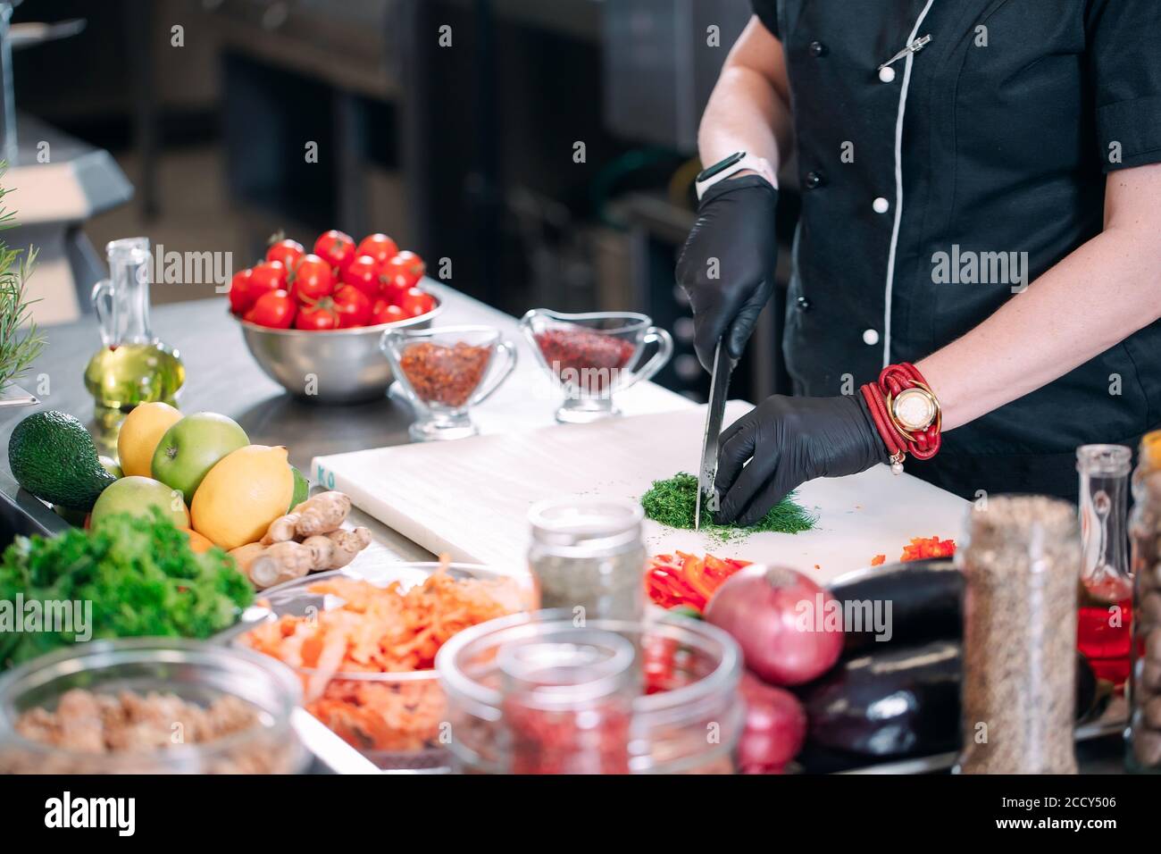Professional cook in kitchen cuts hi-res stock photography and images ...
