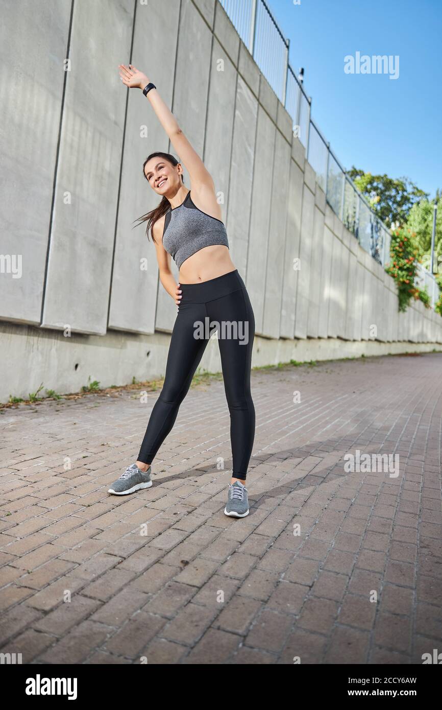 Young active woman doing morning exercises with pleasure Stock Photo ...