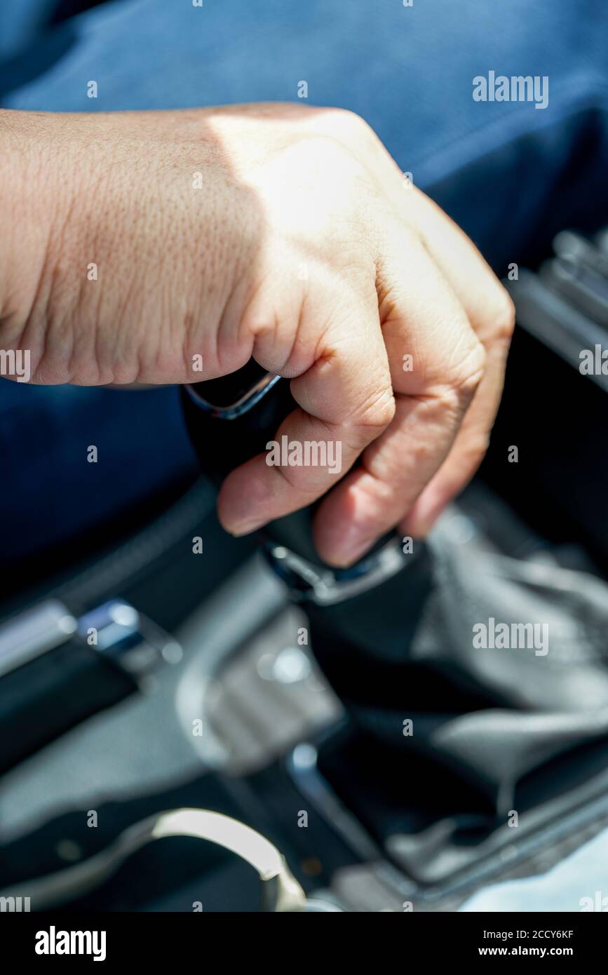 A driver is driving, shifting gears close-up Stock Photo - Alamy