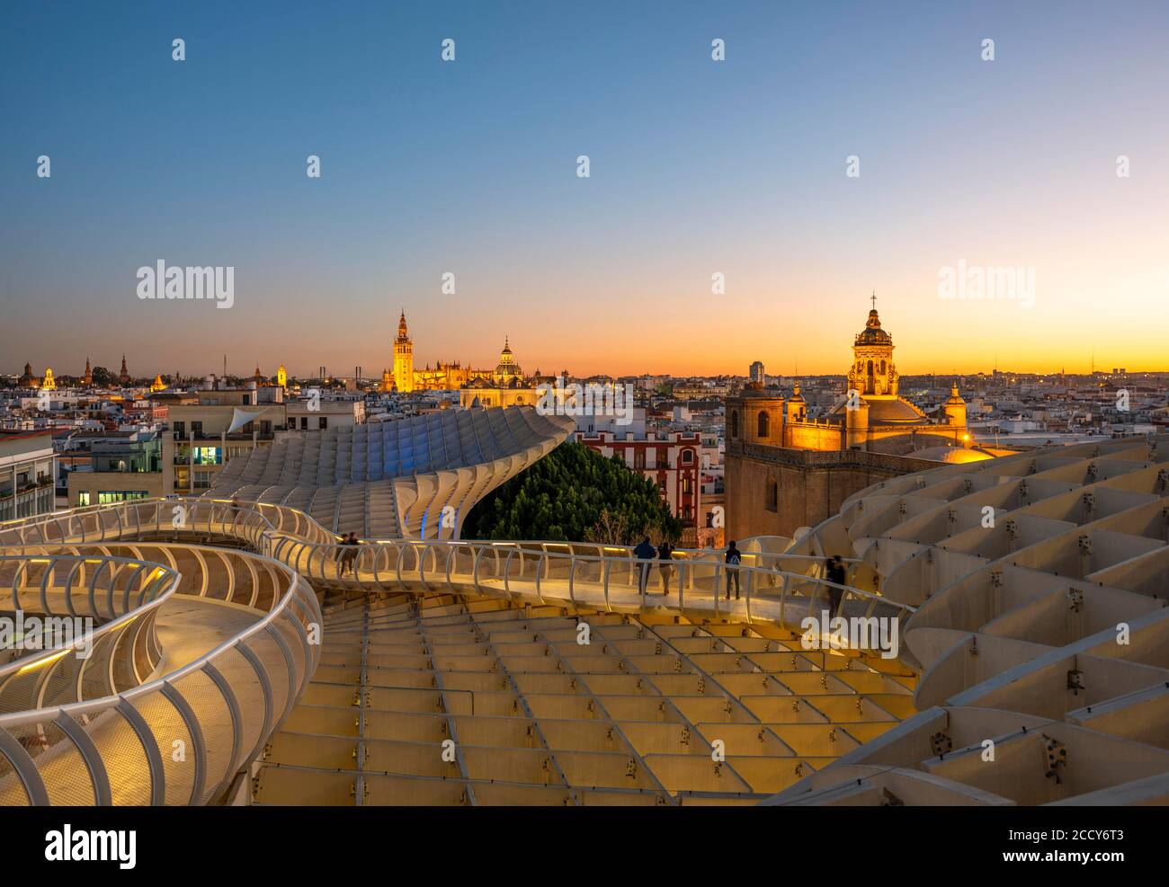 View over Sevilla from Metropol Parasol at sunset, curved wooden ...