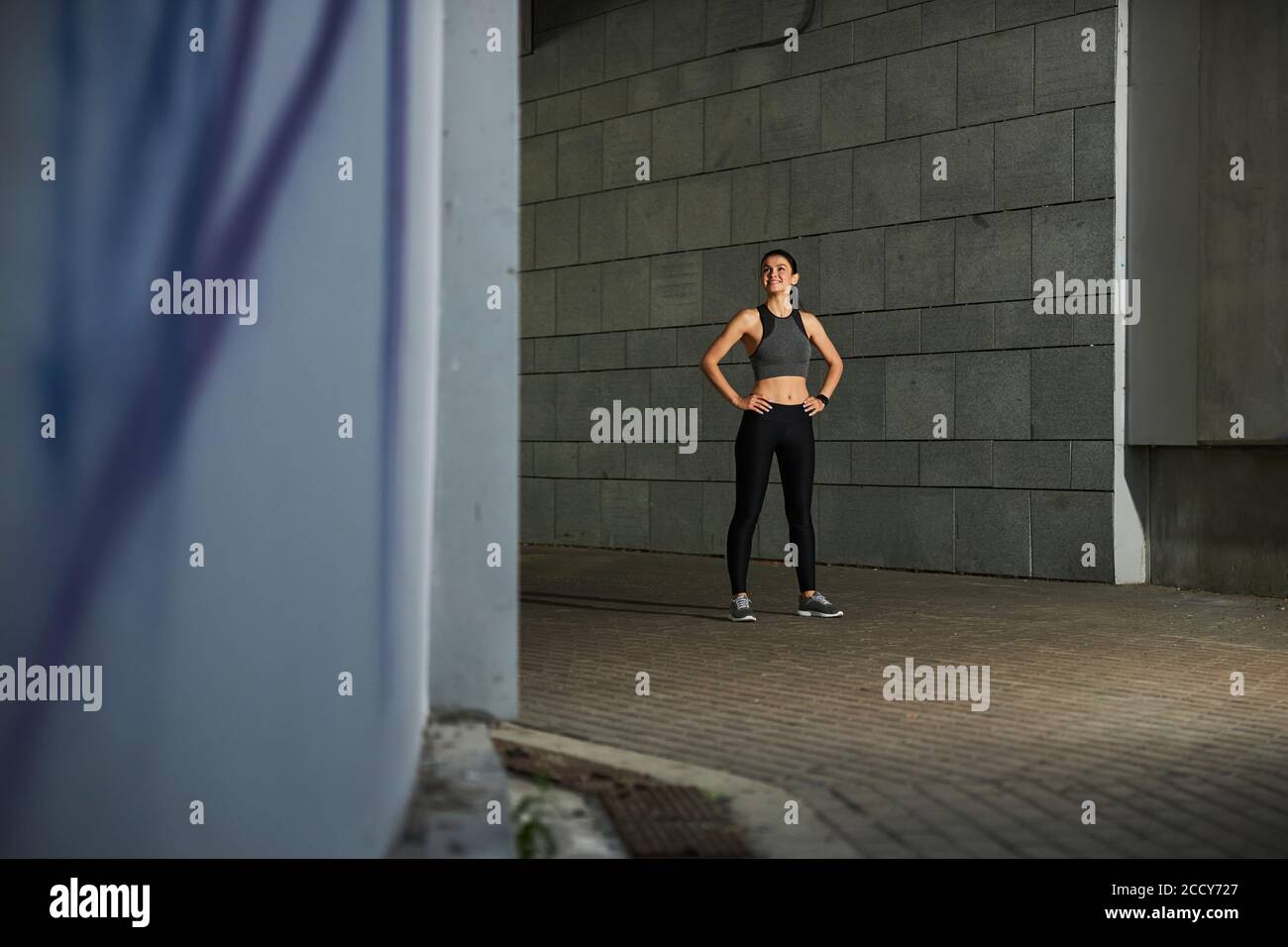 Active young female person having pause during running Stock Photo - Alamy
