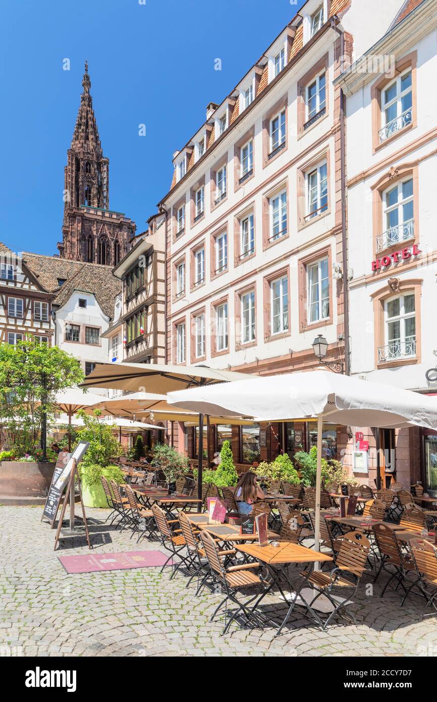 Street cafes in the old town with view of the cathedral, Strasbourg ...