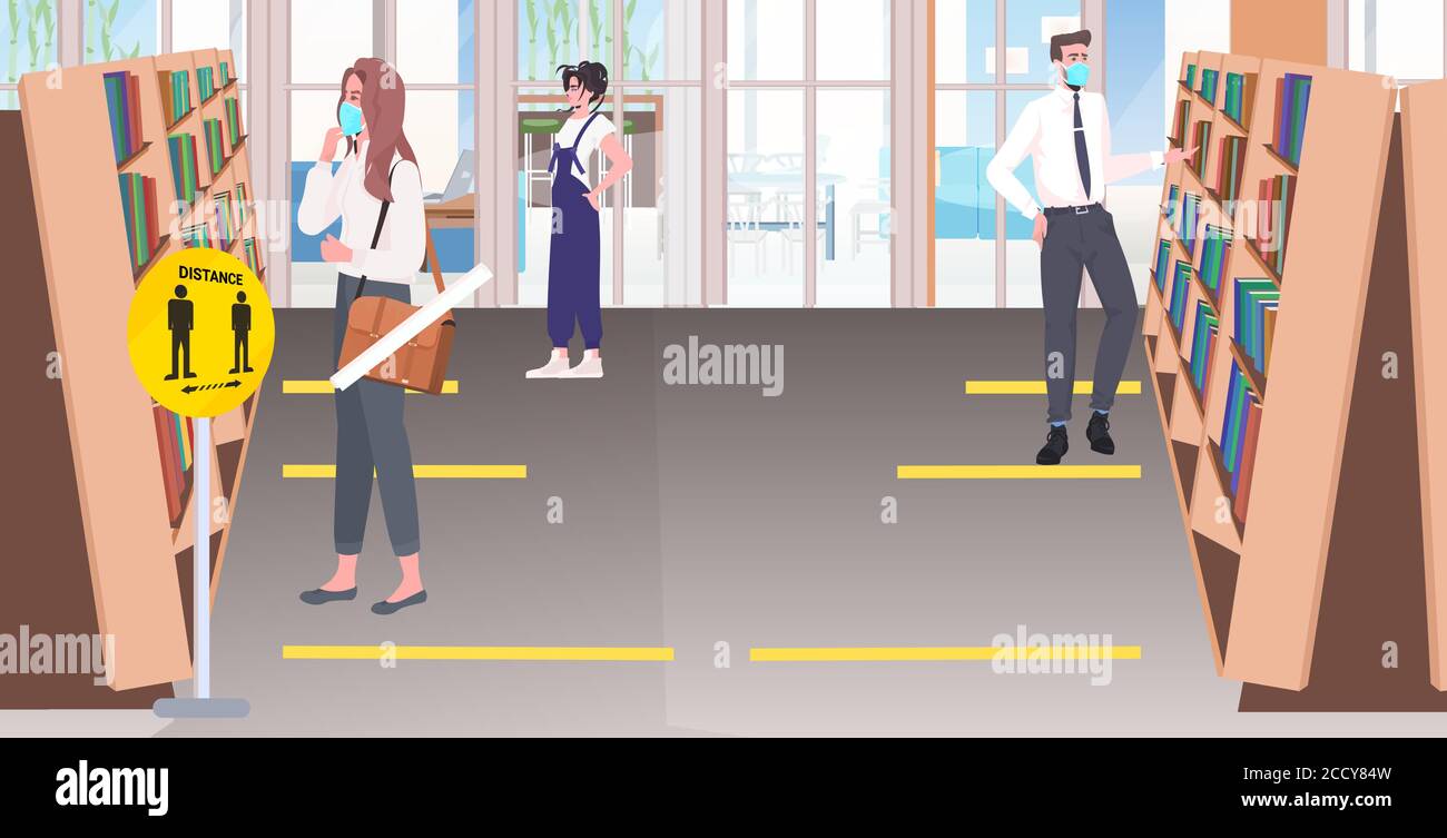 people in masks keeping distance library with signs for social ...