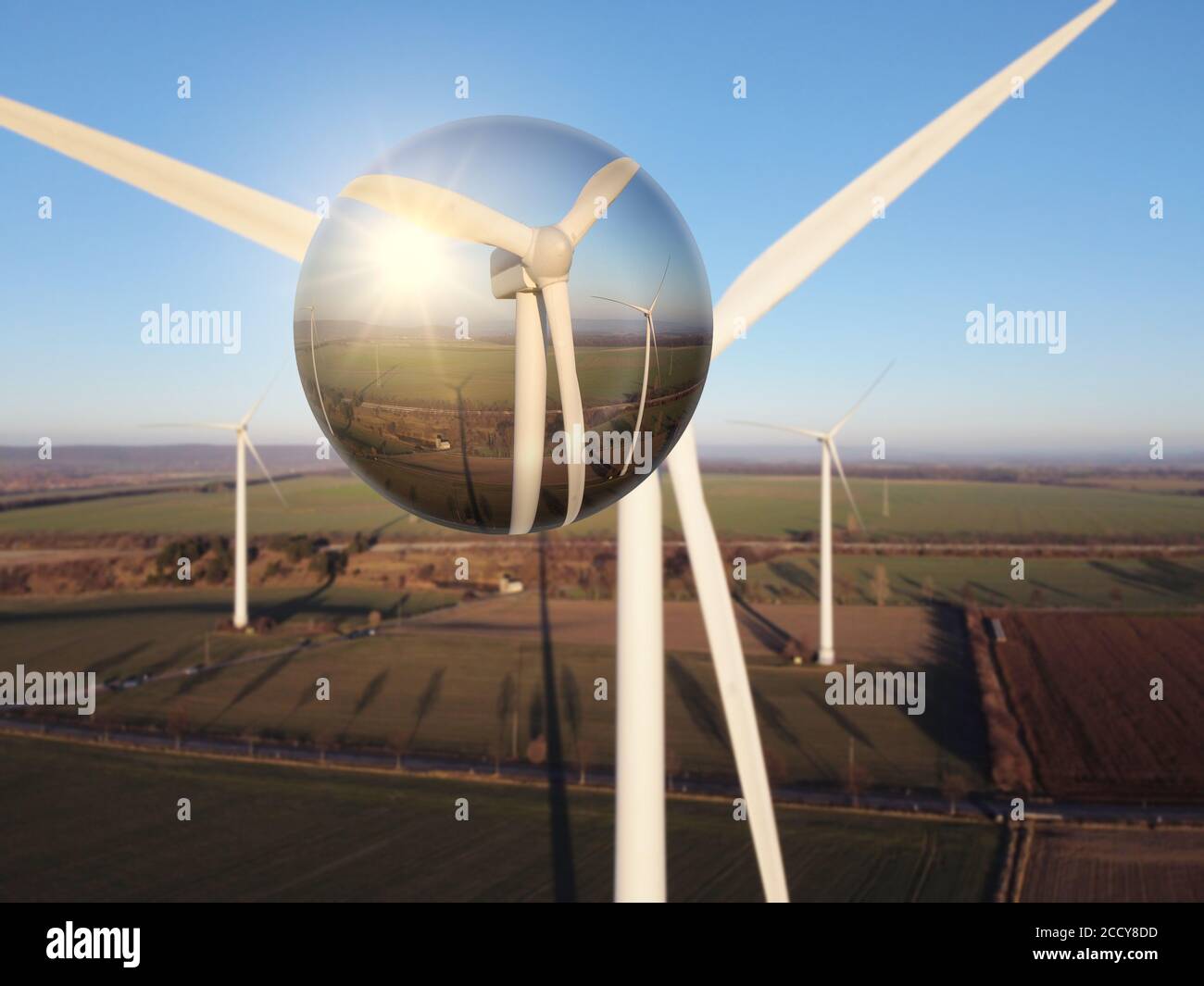 Aerial drone view of wind turbines. Green energy concept with creative ...
