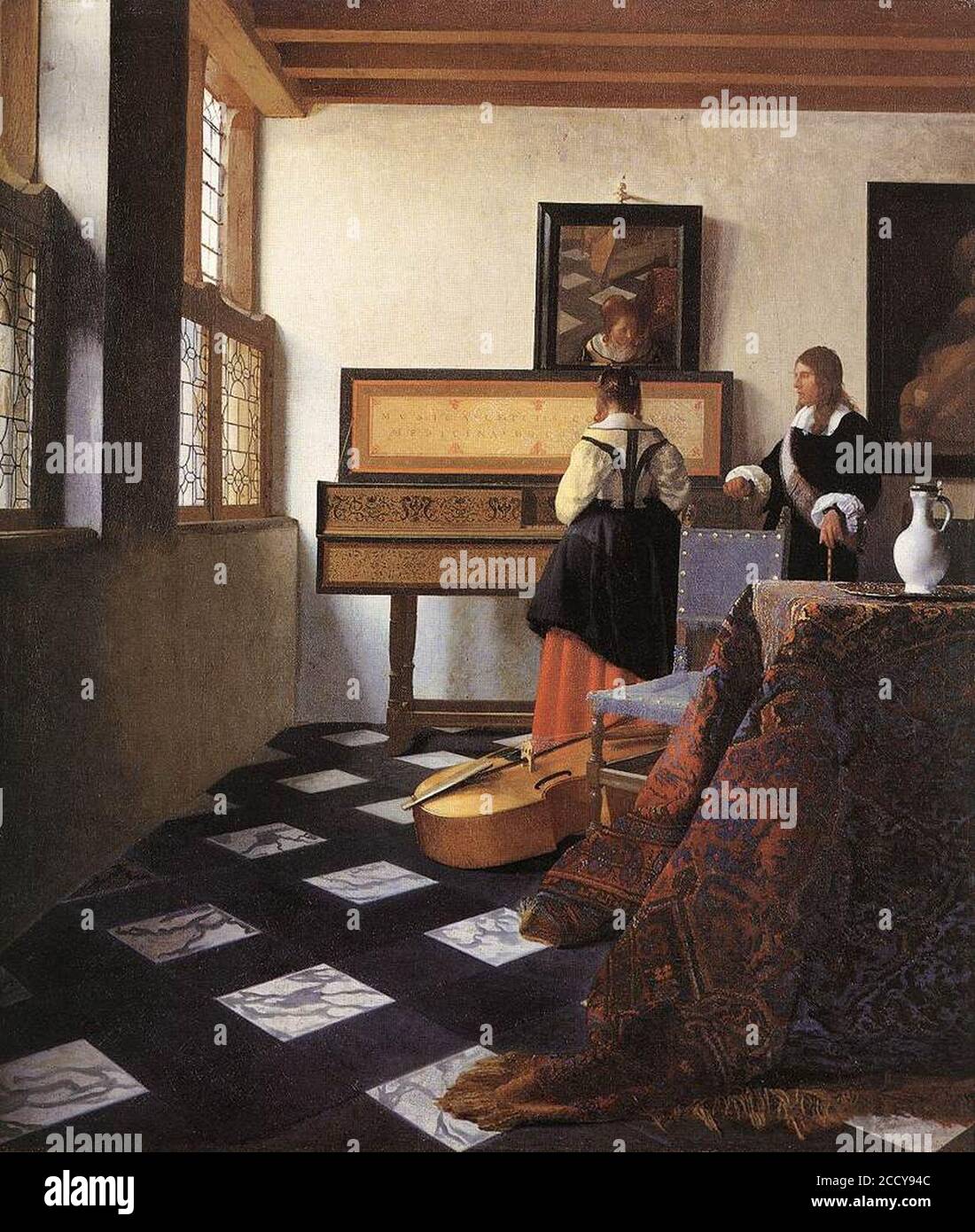 Johannes Vermeer - A Lady at the Virginals with a Gentleman Stock Photo ...