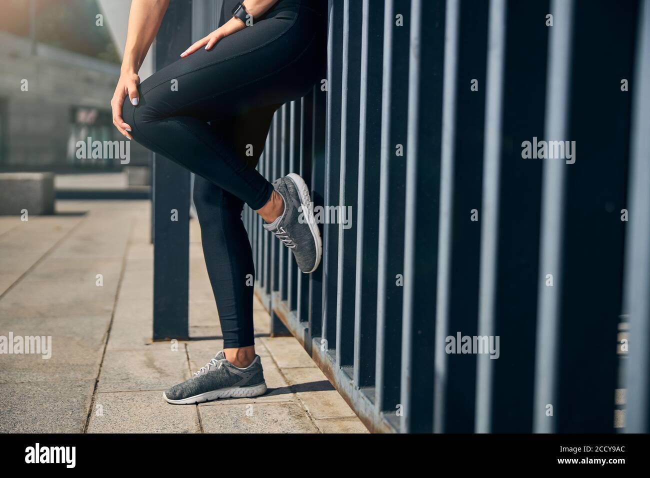 Close up of sporty female touching her knee Stock Photo - Alamy